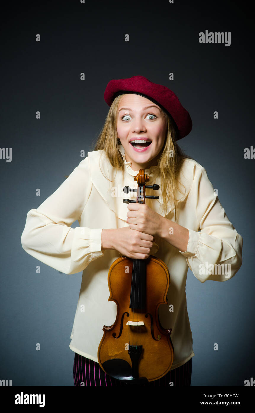 Woman violin player in musical concept Stock Photo - Alamy