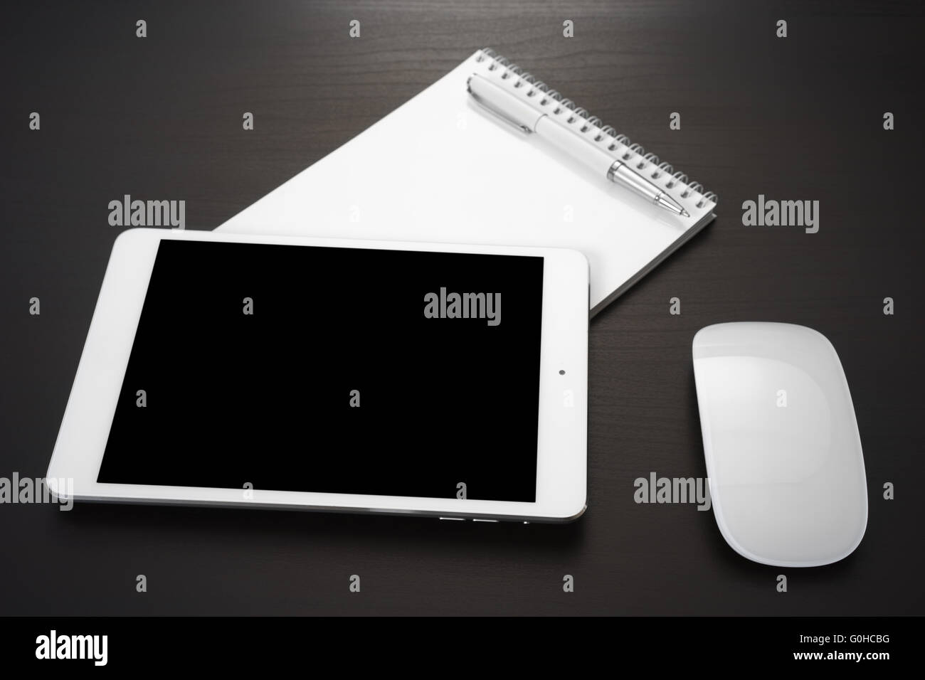 Digital tablet and notepad on office table Stock Photo - Alamy