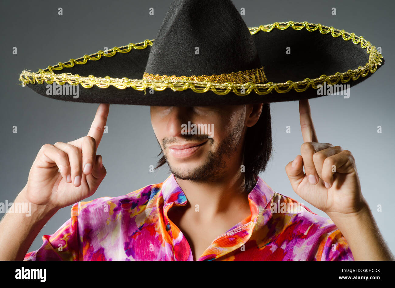 Young mexican man wearing sombrero Stock Photo - Alamy