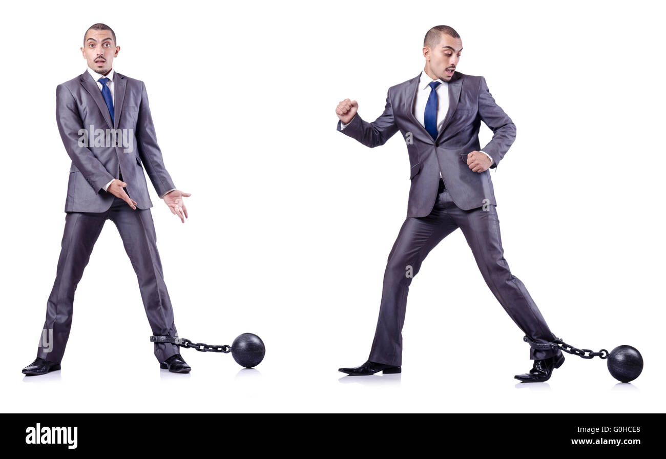 Businessman with shackles on white Stock Photo - Alamy