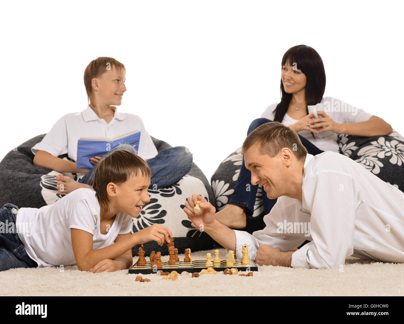 four playing chess Stock Photo - Alamy