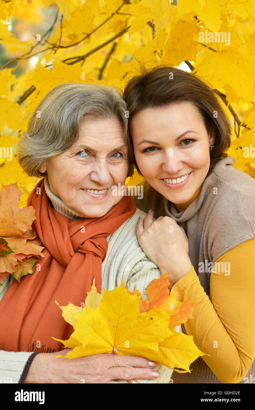 Mother and daughter in autumn park Stock Photo - Alamy