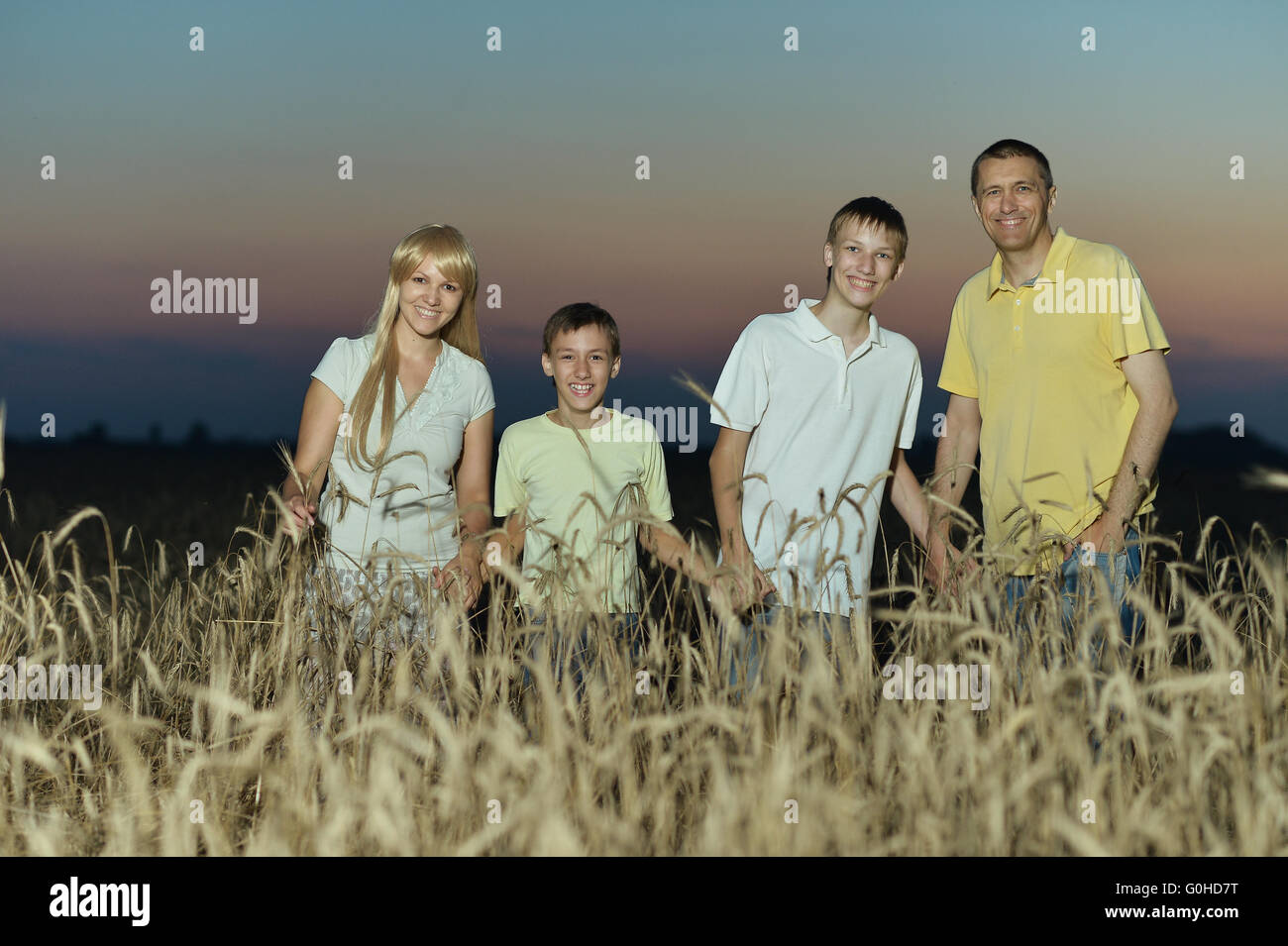 Smiling family jumping Stock Photo - Alamy