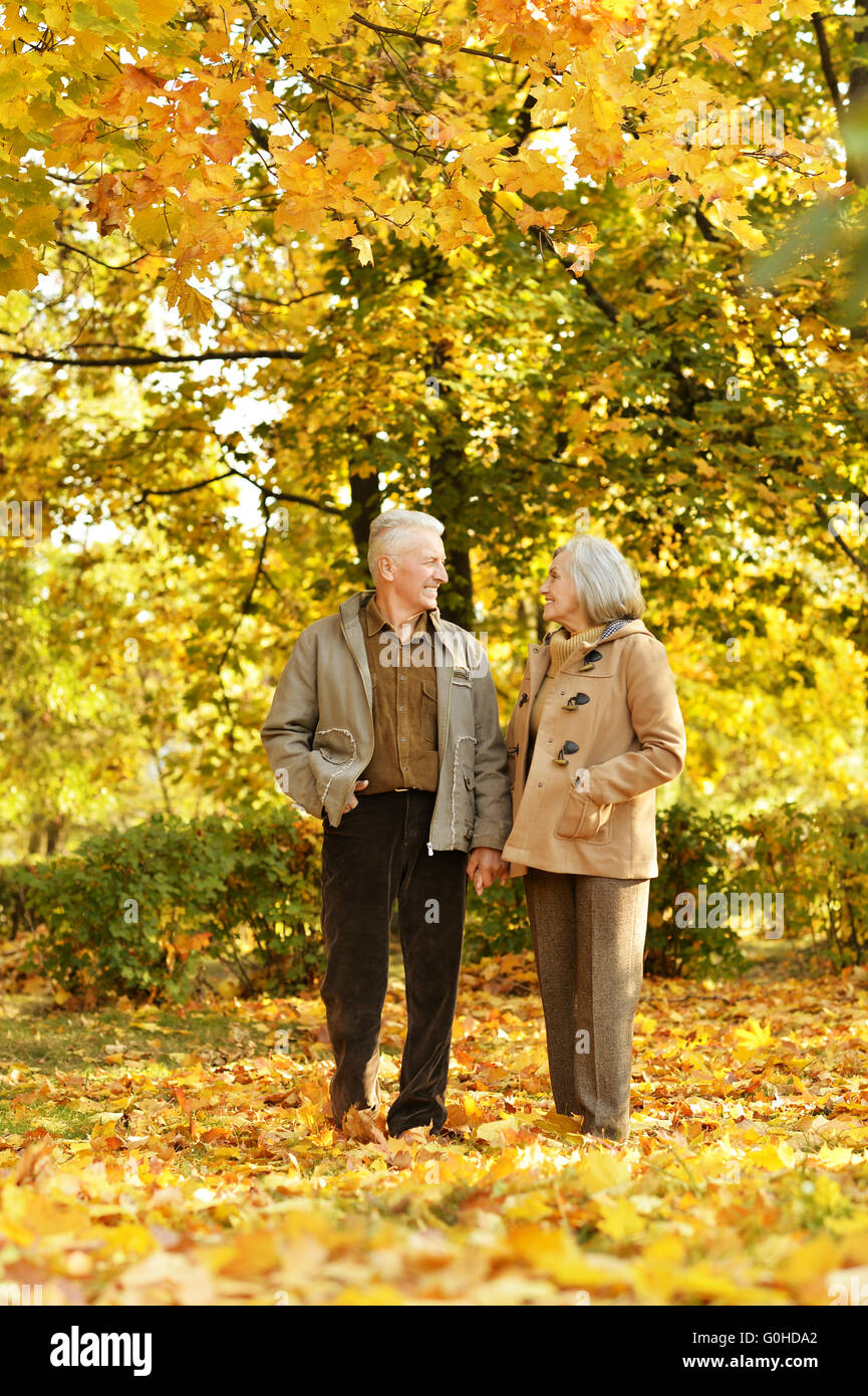 Couple in autumn park Stock Photo - Alamy