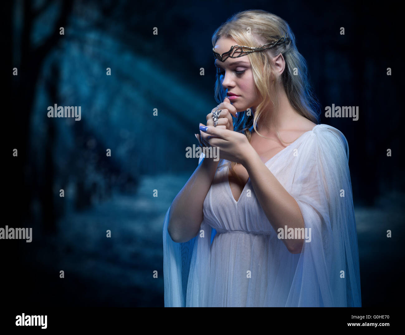 Young elven girl at night forest Stock Photo - Alamy