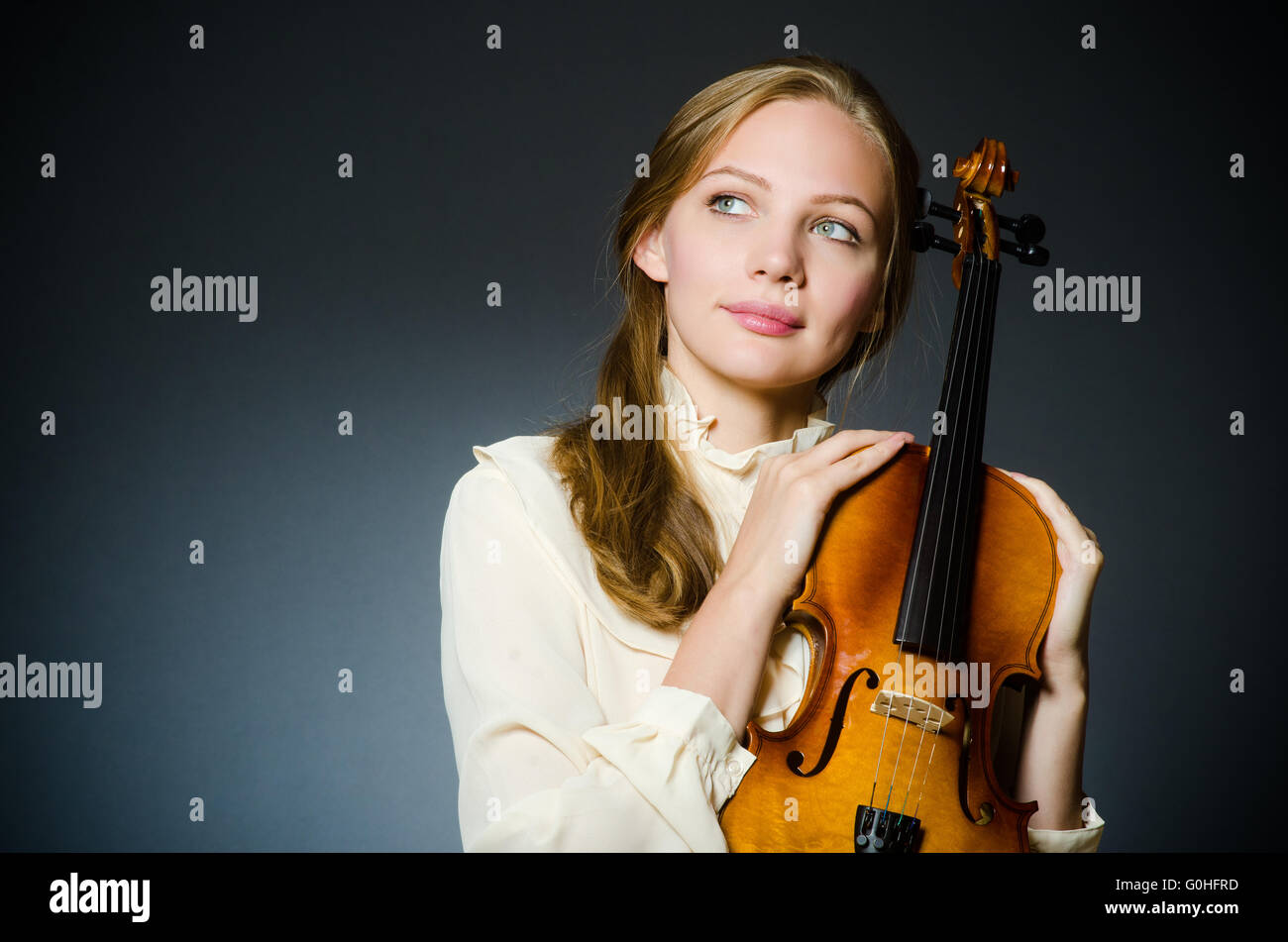 Woman violin player in musical concept Stock Photo - Alamy