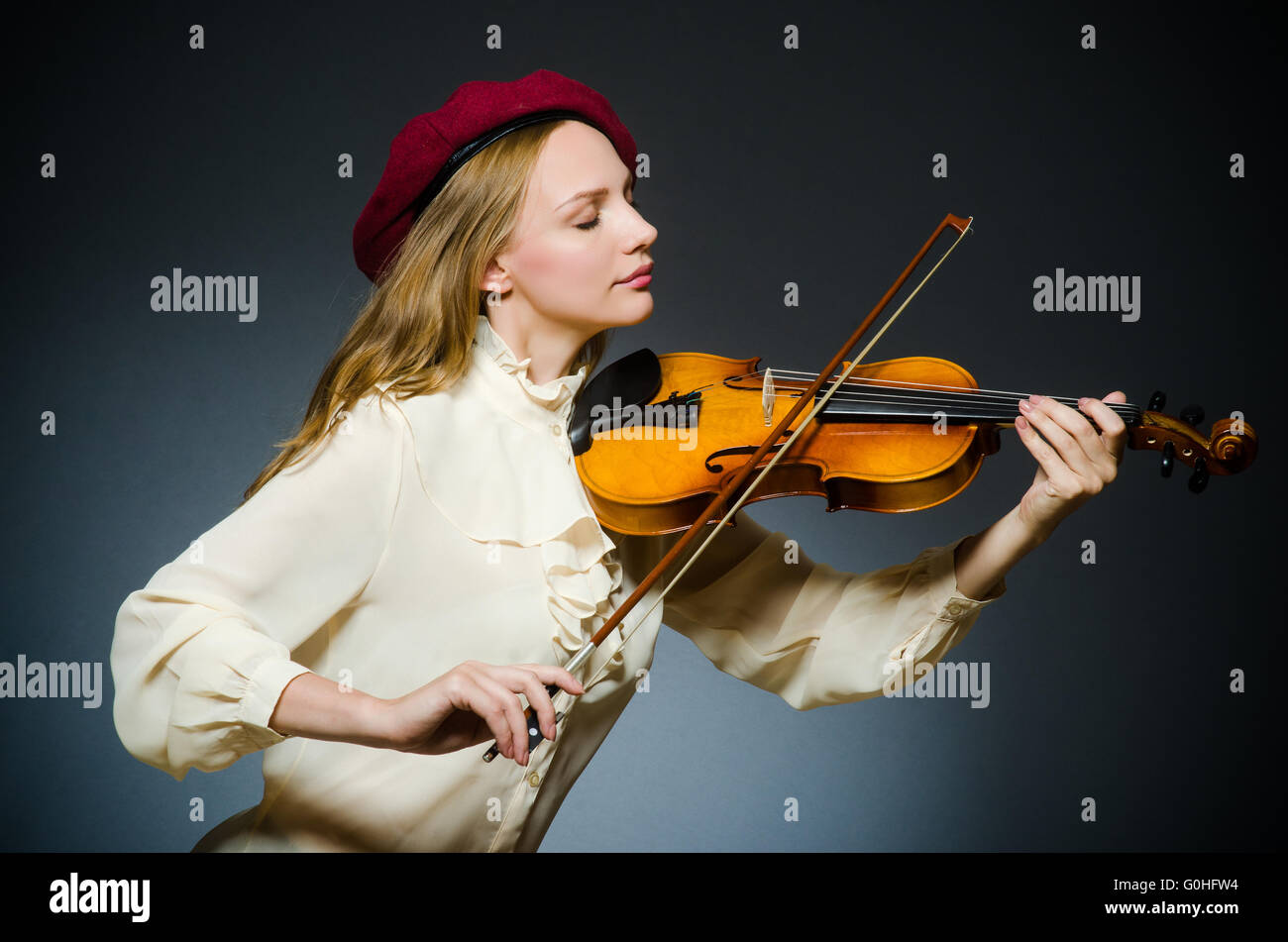 Woman violin player in musical concept Stock Photo - Alamy