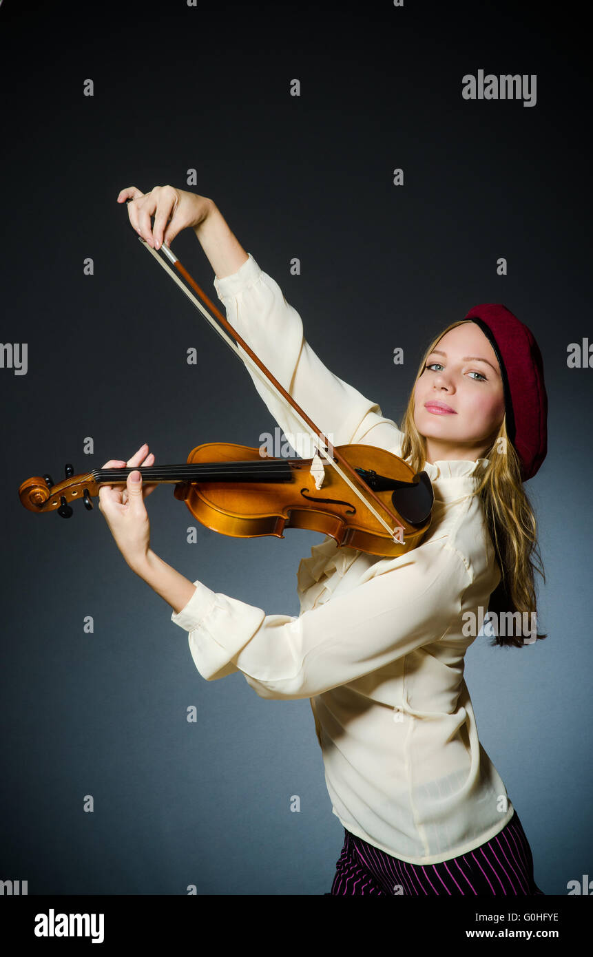 Woman violin player in musical concept Stock Photo - Alamy