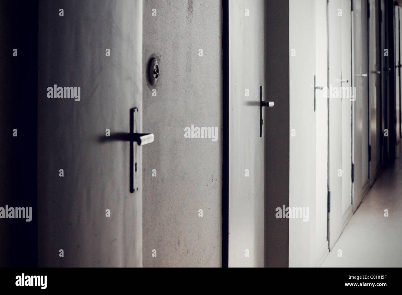Row doors hallway hi-res stock photography and images - Alamy