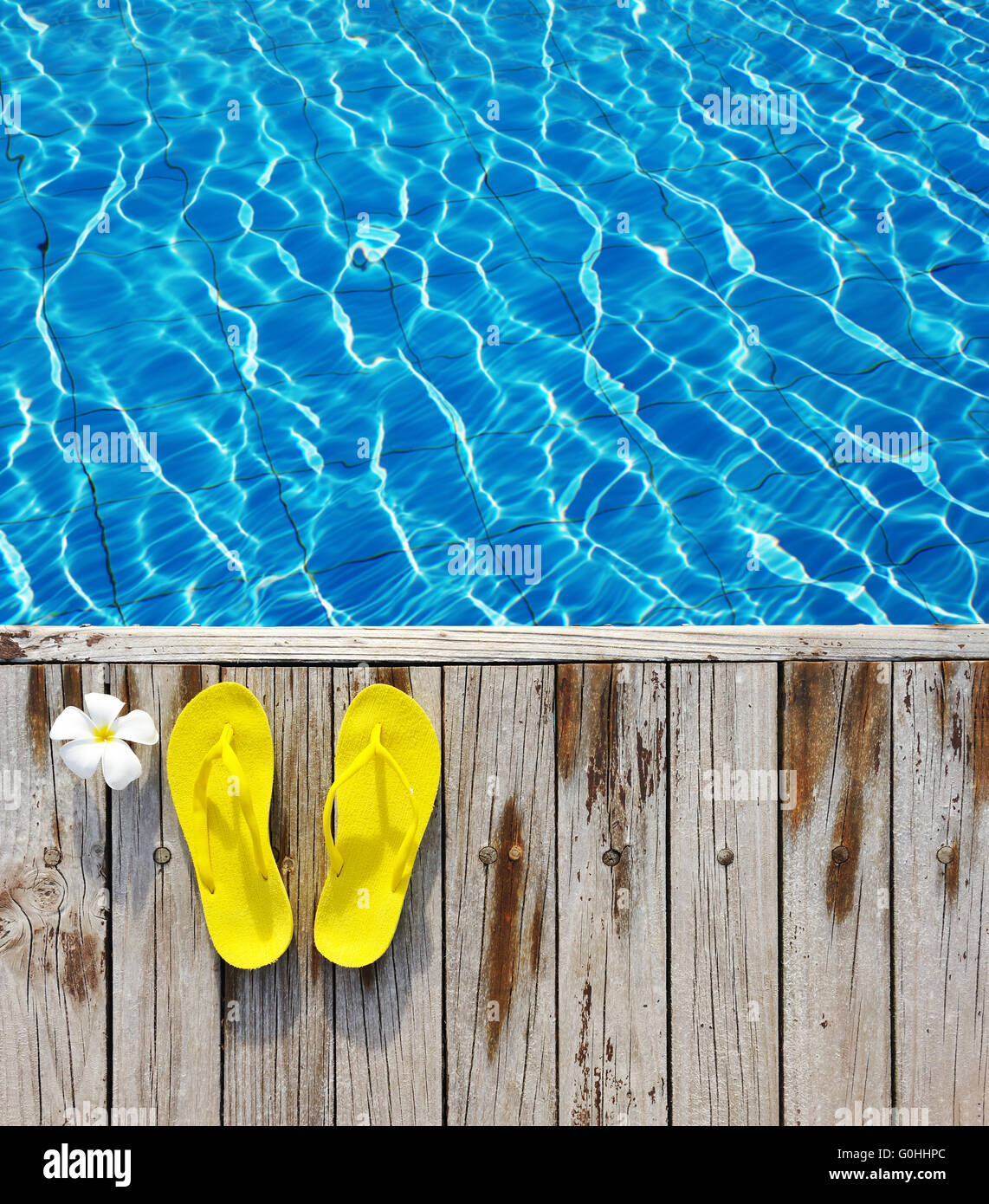 Flip-flops by a swimming pool Stock Photo - Alamy