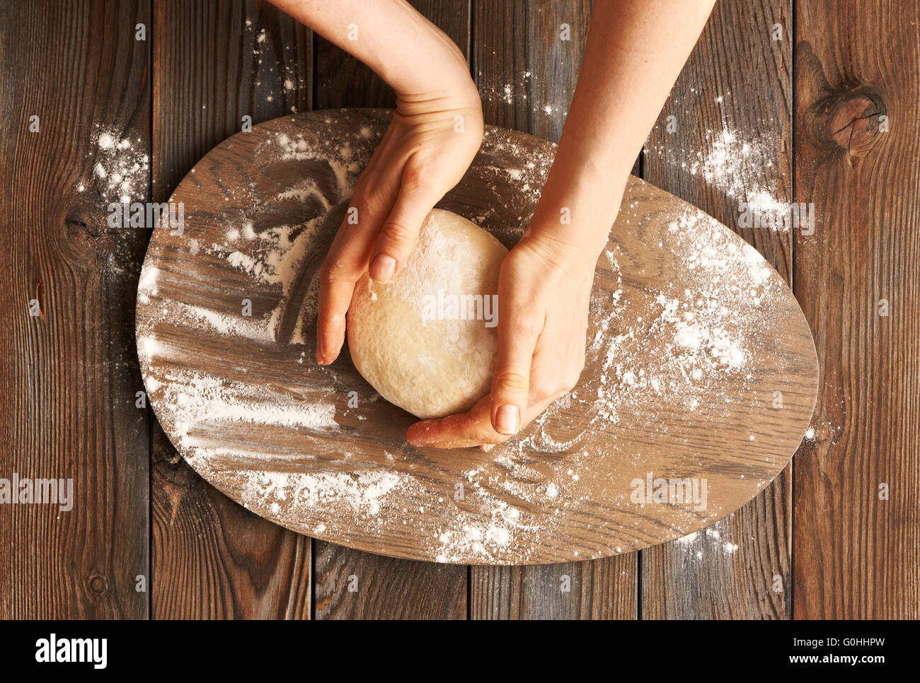 Female hands kneading dough Stock Photo - Alamy