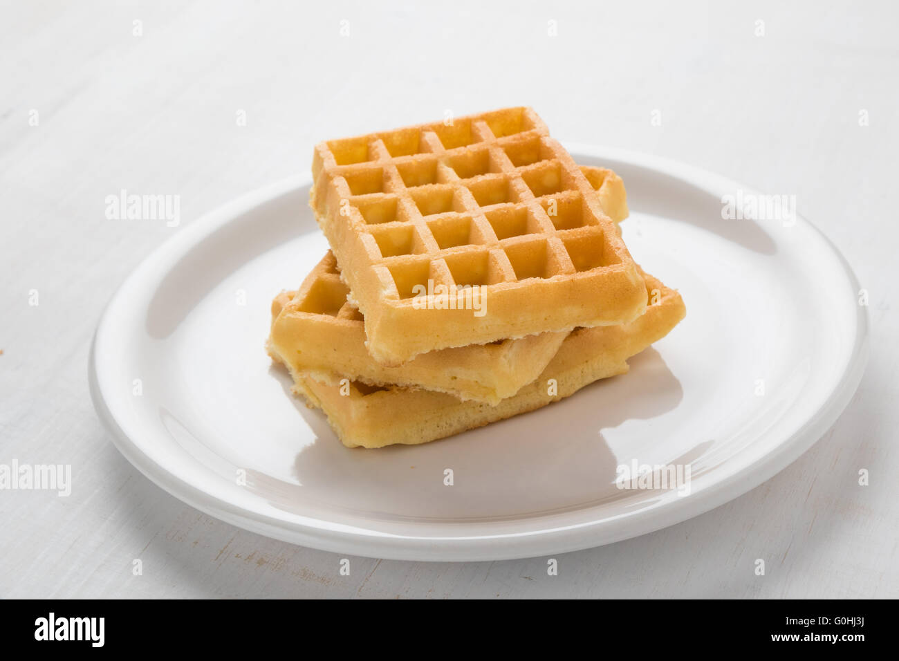 three waffles on plate Stock Photo - Alamy