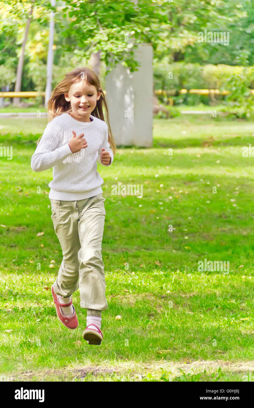 Cute running girl Stock Photo - Alamy