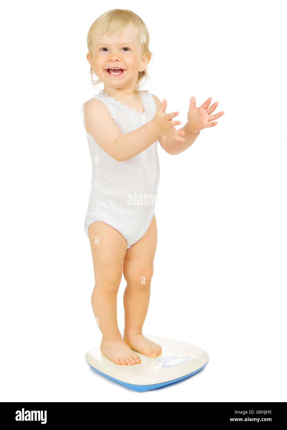 Little child on scales isolated Stock Photo - Alamy