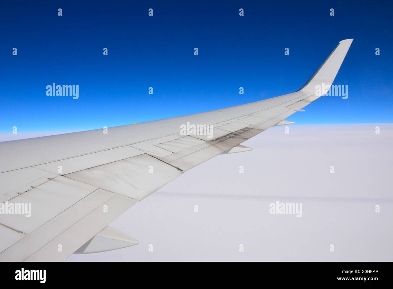 The wing of a commercial jetliner, mid flight Stock Photo - Alamy