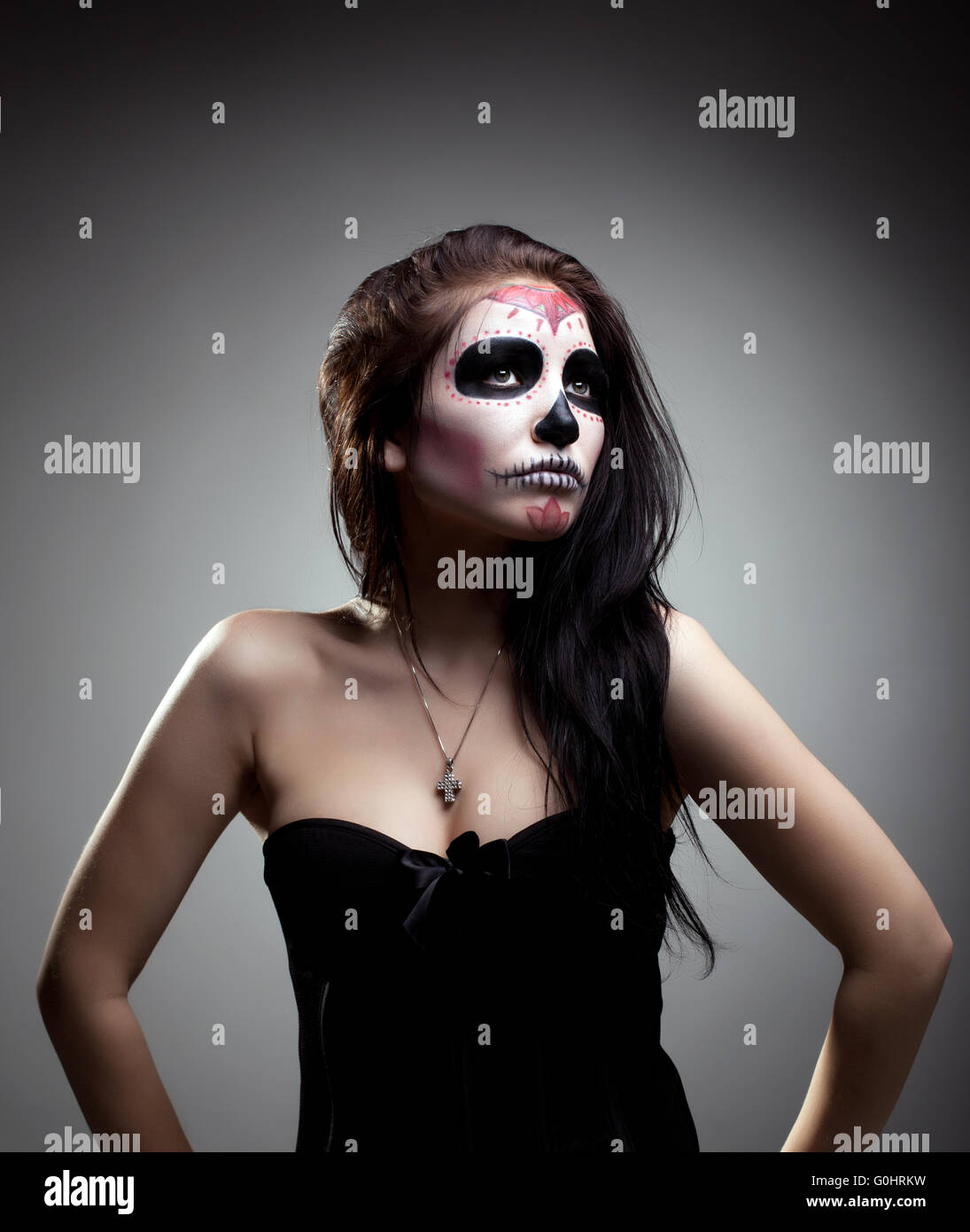 Young woman in day of the dead mask skull face art Stock Photo - Alamy