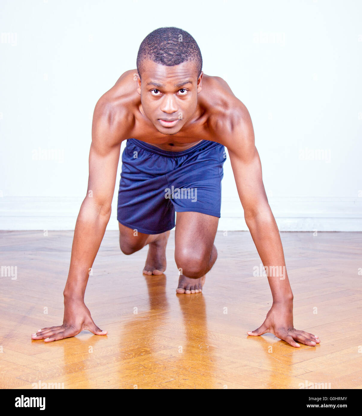 young muscular boy is doing a workout Stock Photo - Alamy