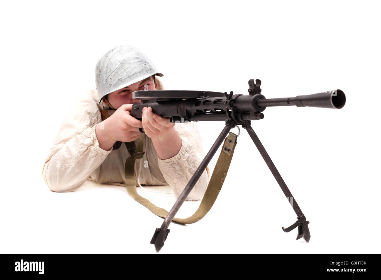 Soldier with rifle posing in studio, close-up Stock Photo - Alamy