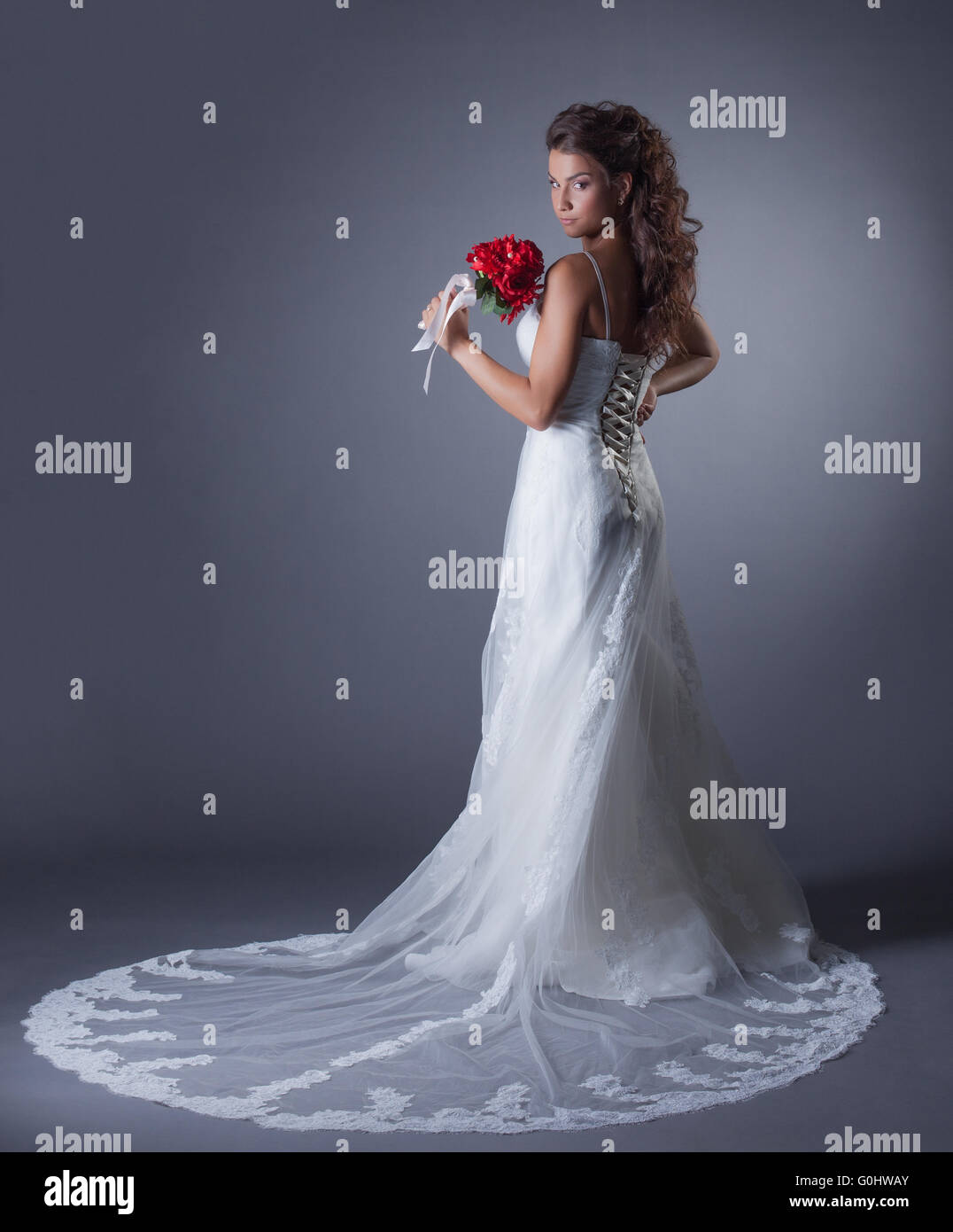 Image of charming bride posing in elegant dress Stock Photo - Alamy