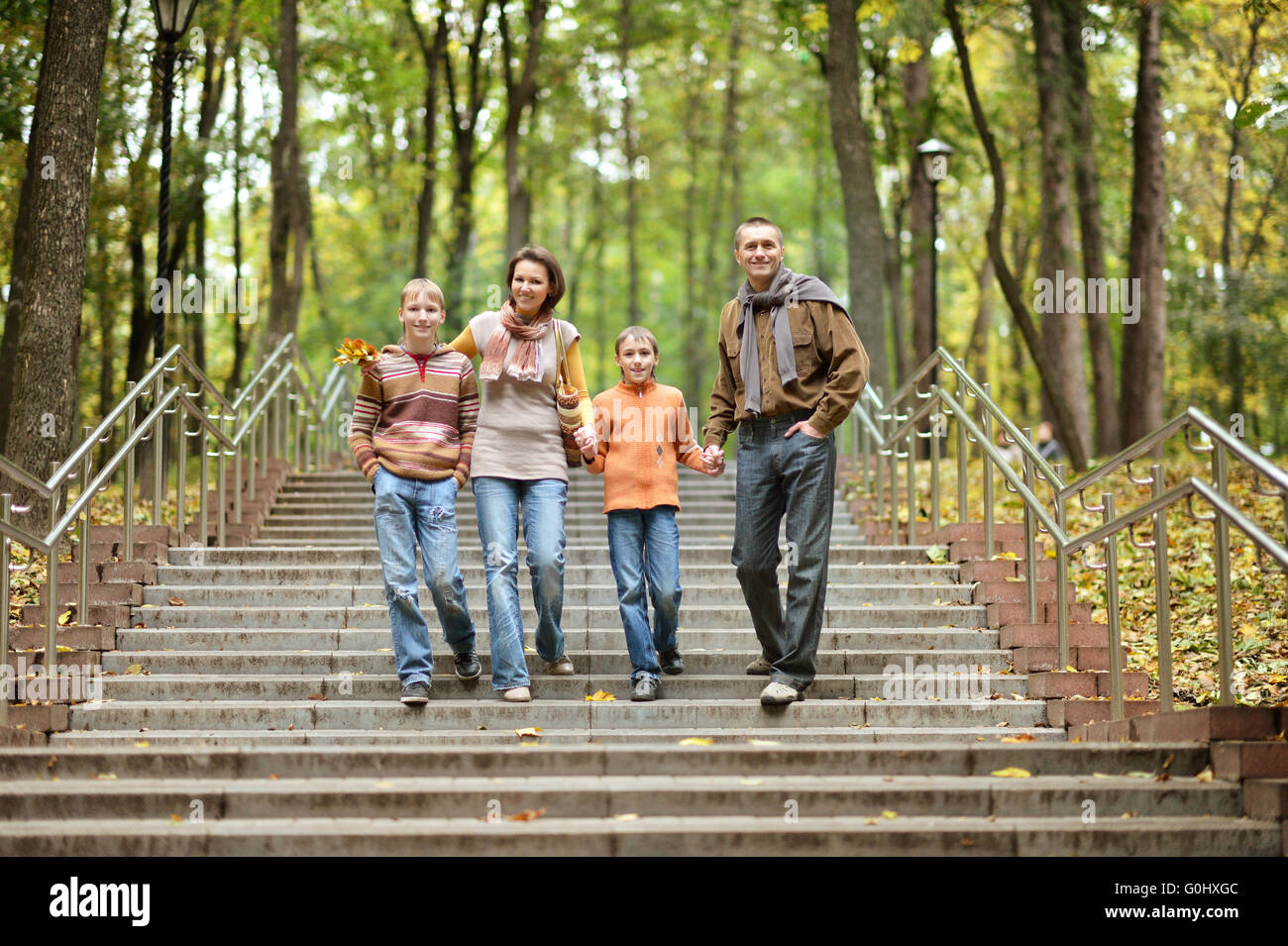 Happy family of four Stock Photo - Alamy