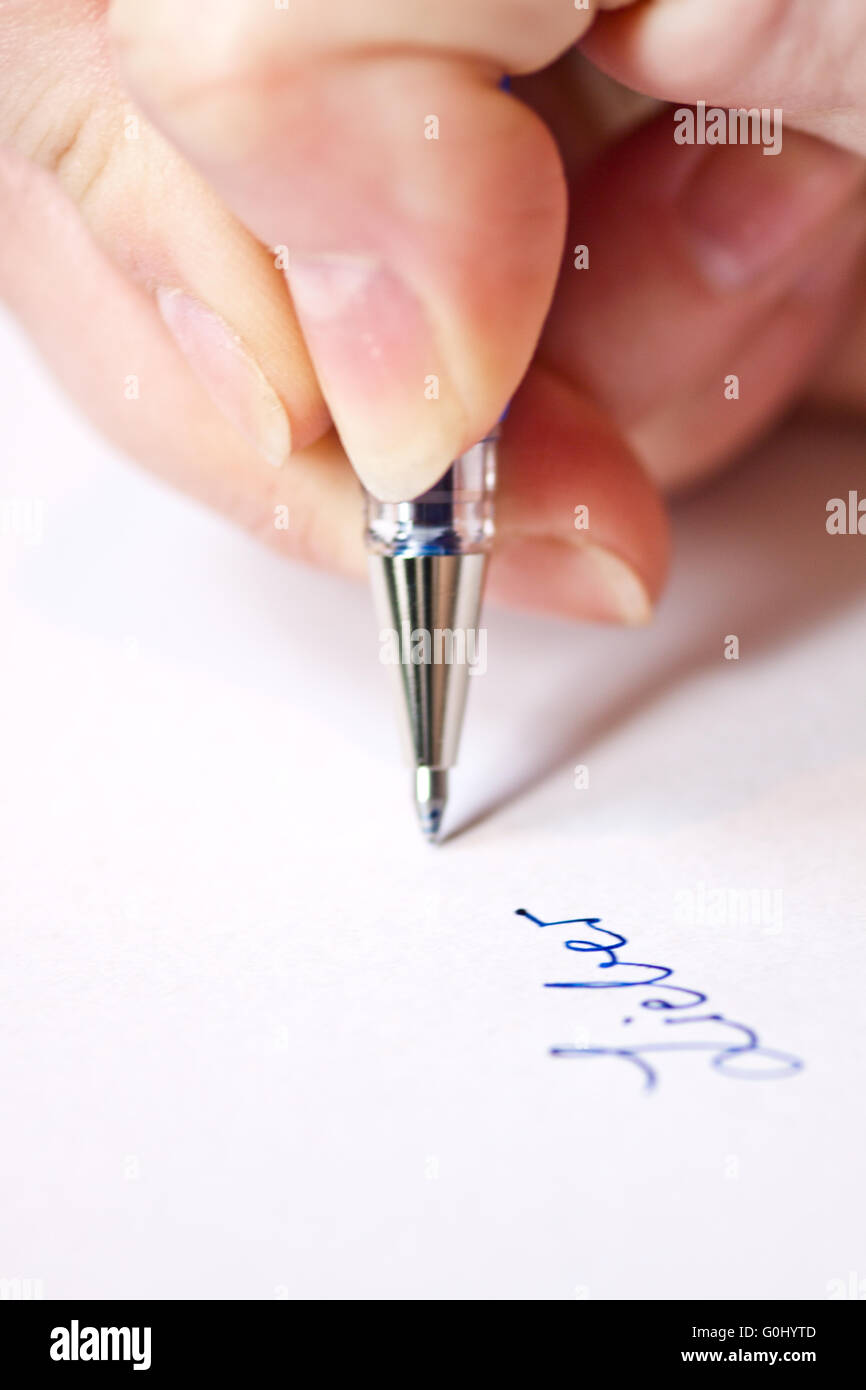 womans hand is writing a letter with a pen Stock Photo - Alamy