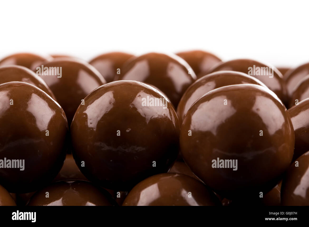 Multiple chocolate ball candies composition, isolated over the white ...