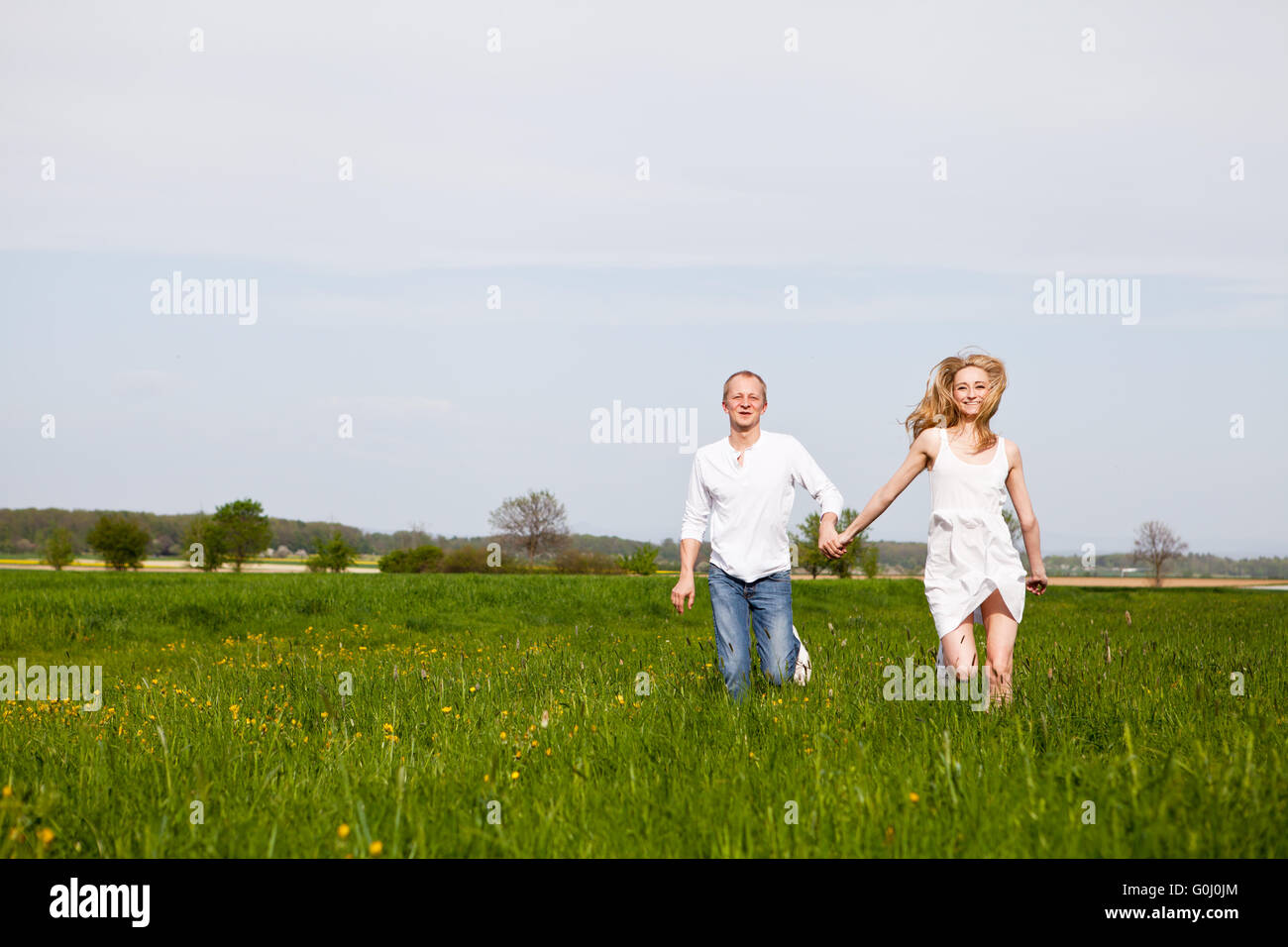 young happy couple have fun in summer Stock Photo - Alamy