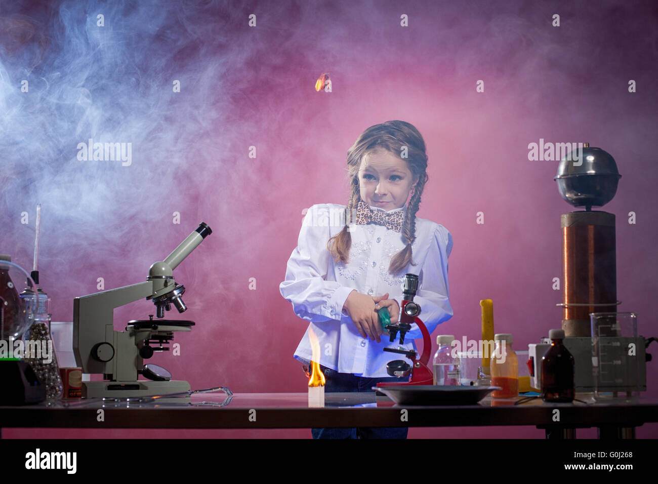 Studio shot of startled little girl in laboratory Stock Photo - Alamy