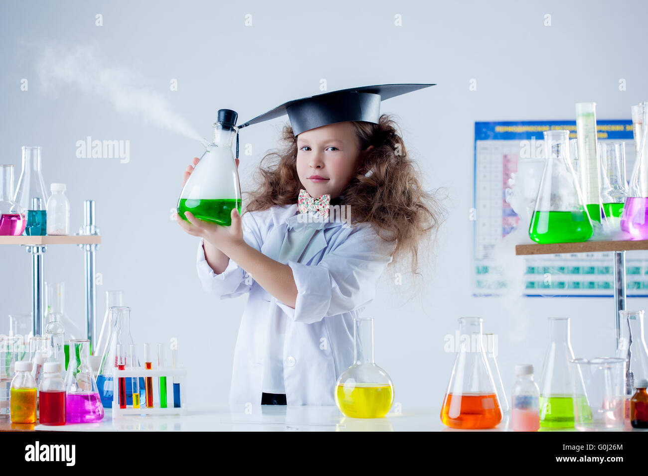 Pretty little brunette posing in chemistry lab Stock Photo - Alamy