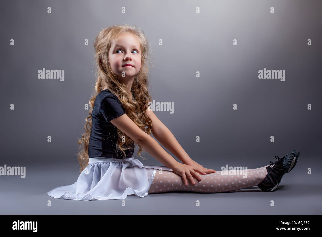Adorable dancer posing in costume for performances Stock Photo - Alamy