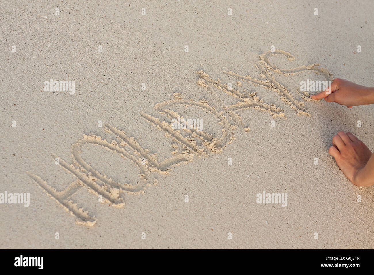hand writing in sand in summer holidays on beach Stock Photo - Alamy