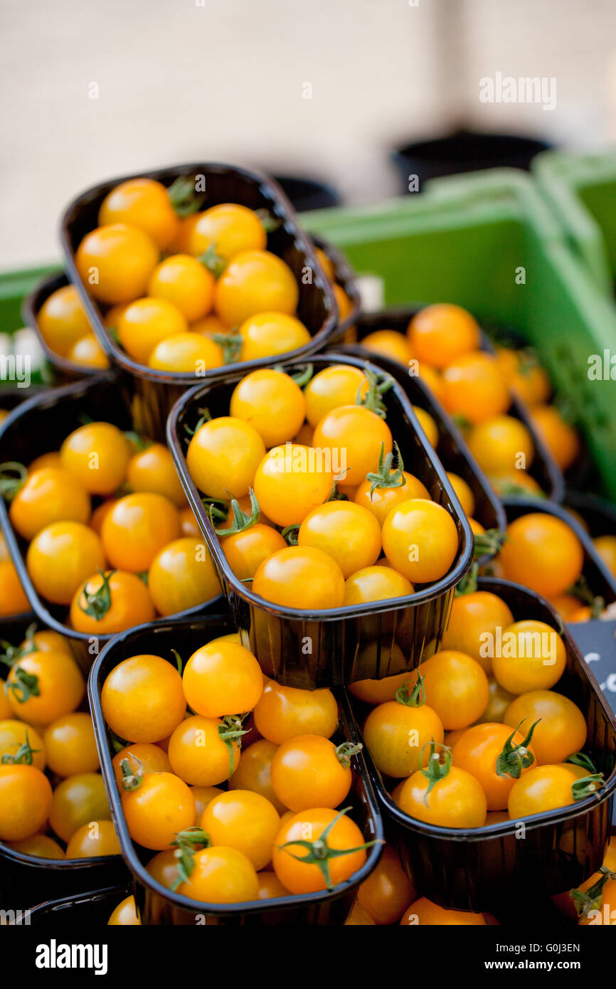 fresh tasty yellow cherry tomatoes macro closeup on market Stock Photo ...