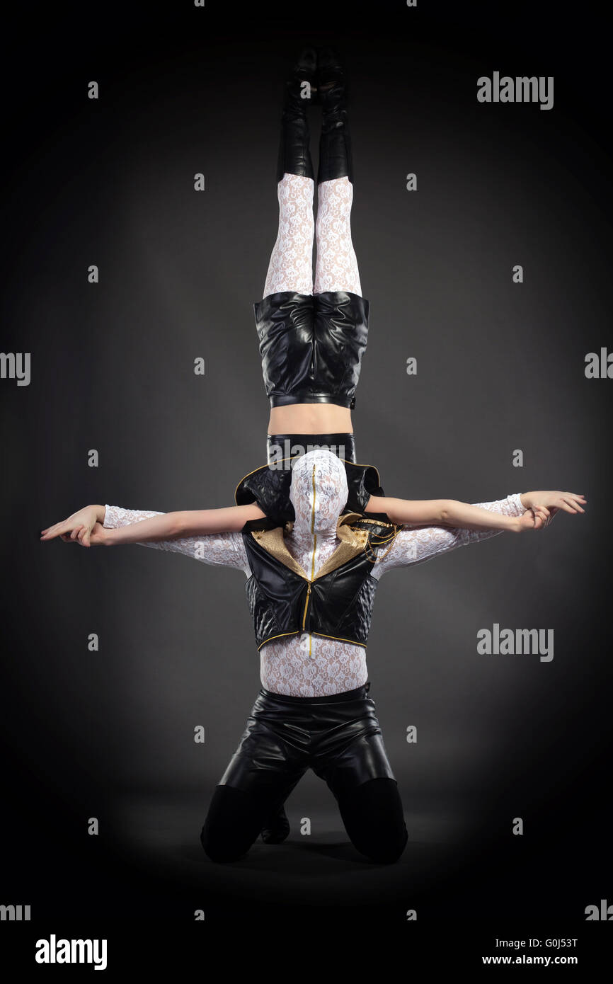 Shot of acrobatic stunt performed by go-go dancers Stock Photo - Alamy