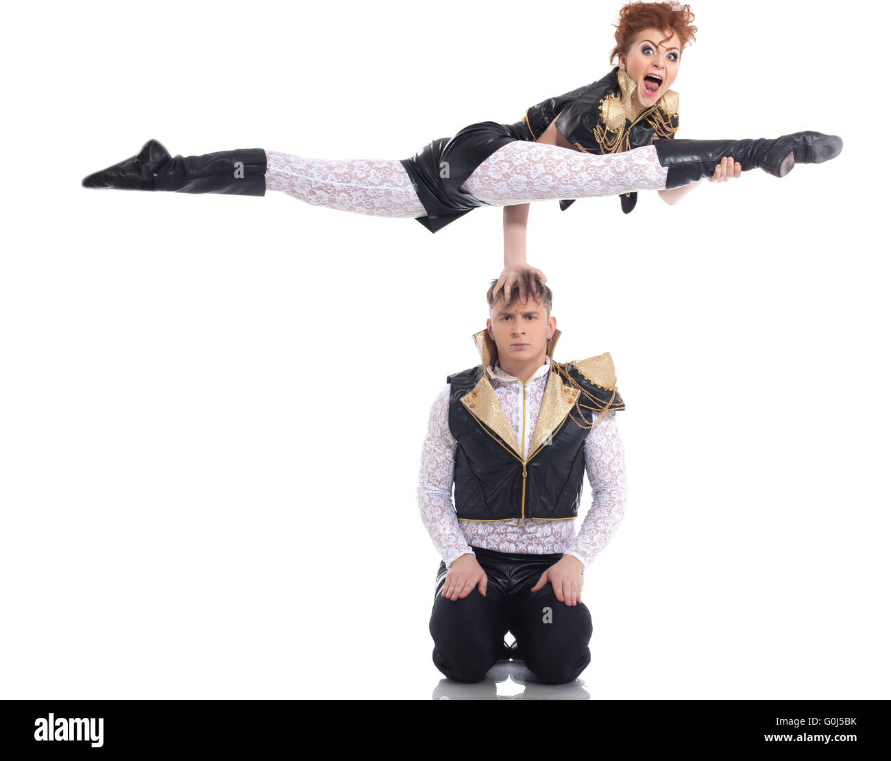 Emotional go-go performers doing acrobatic trick Stock Photo - Alamy