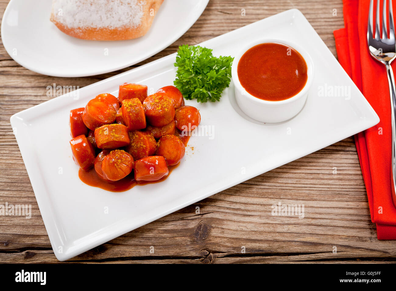curry wurst spicy sausage with curry and ketchup Stock Photo - Alamy