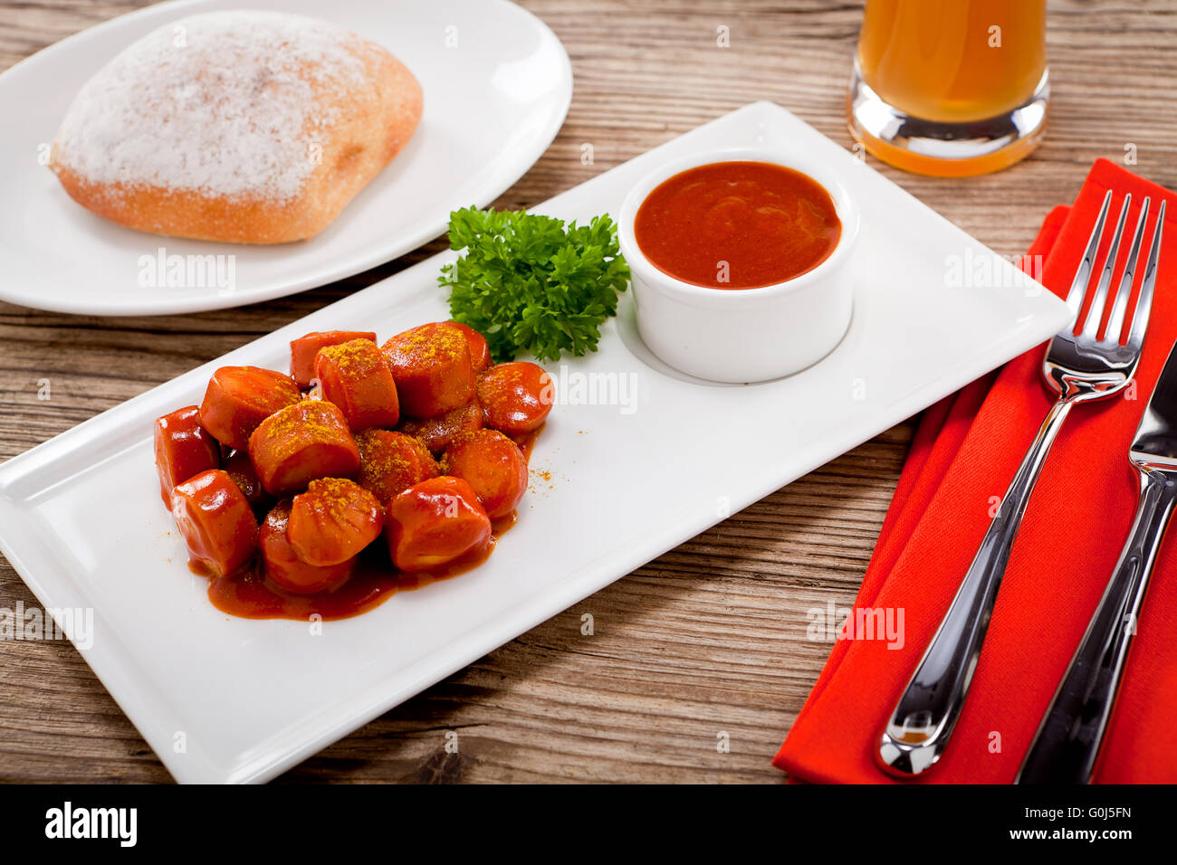 curry wurst spicy sausage with curry and ketchup Stock Photo - Alamy