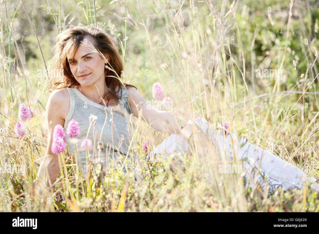 adult brunette woman smiling in summertime outdoor Stock Photo - Alamy