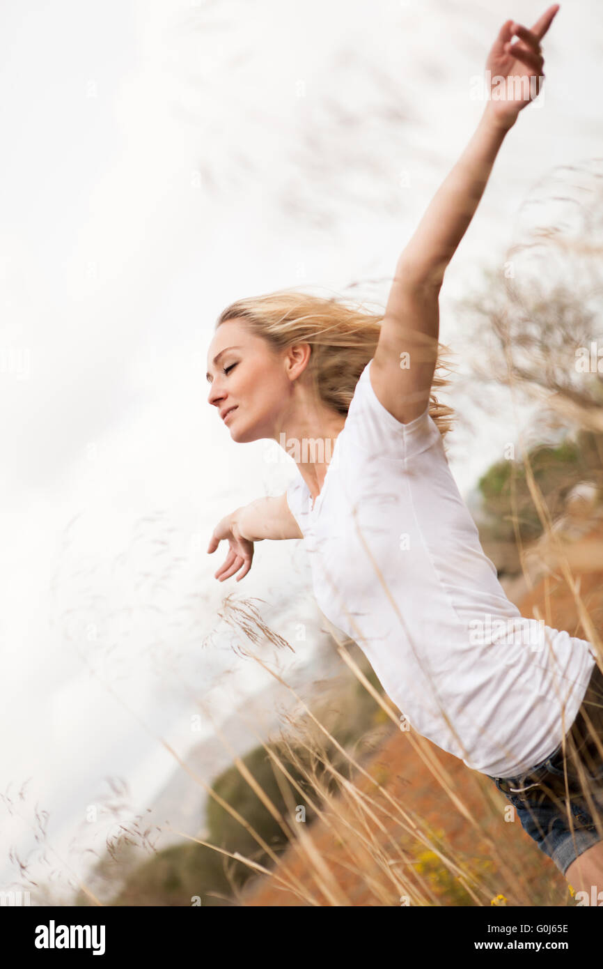young happy attractive woman arms wide open Stock Photo - Alamy