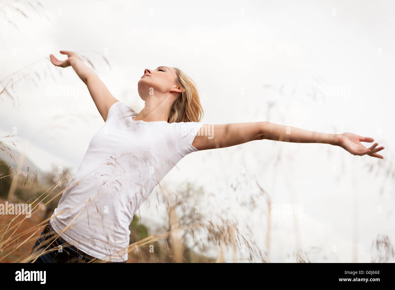 young happy attractive woman arms wide open Stock Photo - Alamy
