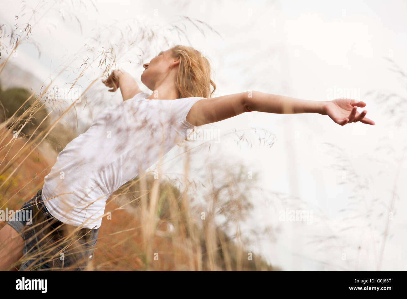Girl arms wide open hi-res stock photography and images - Alamy