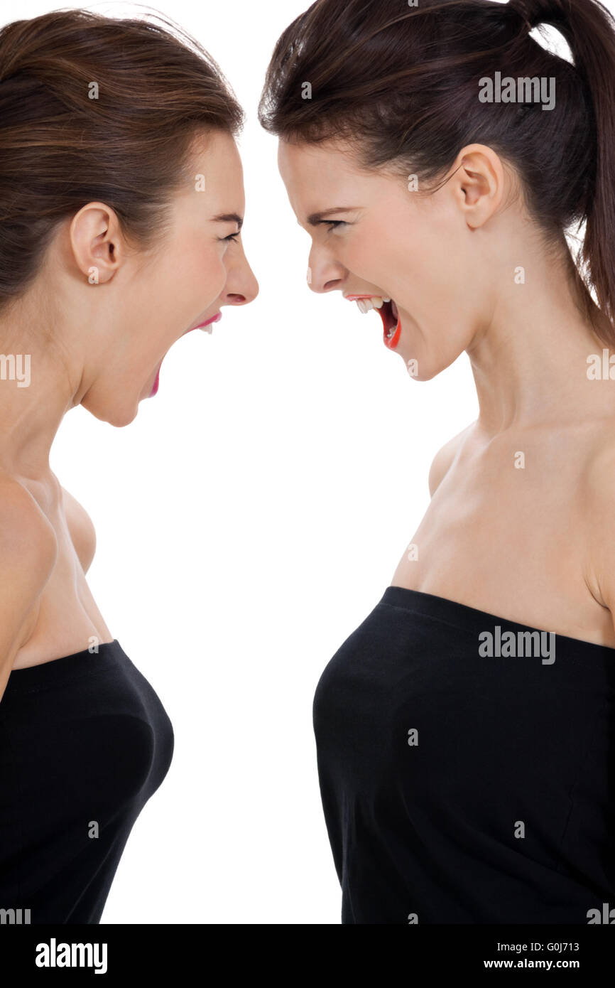 two young girls angry shouting loud isolated Stock Photo - Alamy