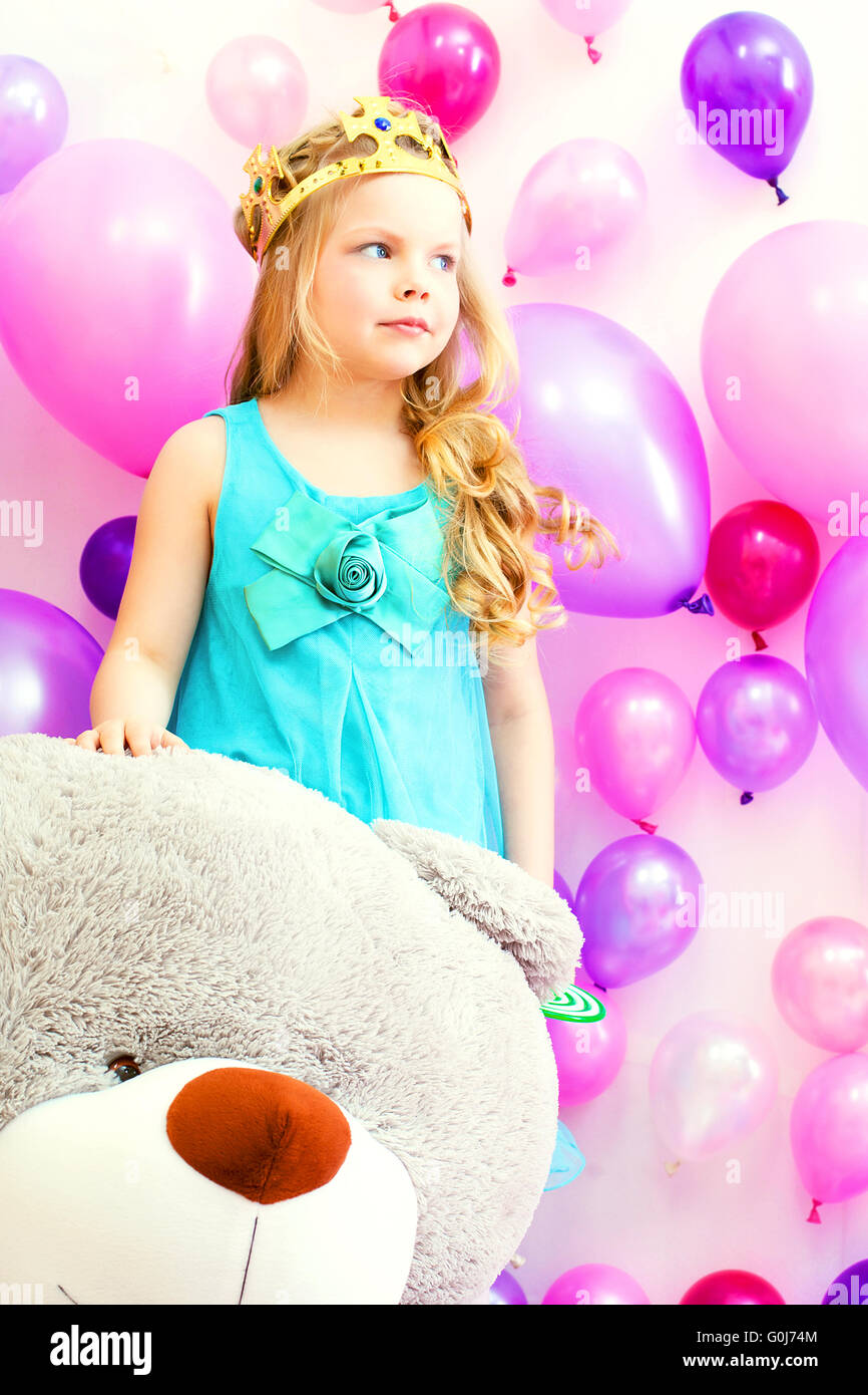 Studio shot of cute girl posing with teddy bear Stock Photo - Alamy