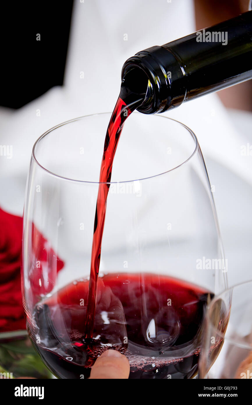 couple drinking red wine in restaurant Stock Photo - Alamy