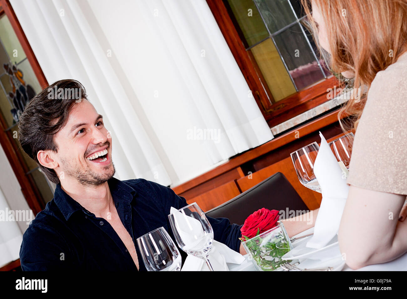 happy smiling couple in restaurant Stock Photo - Alamy