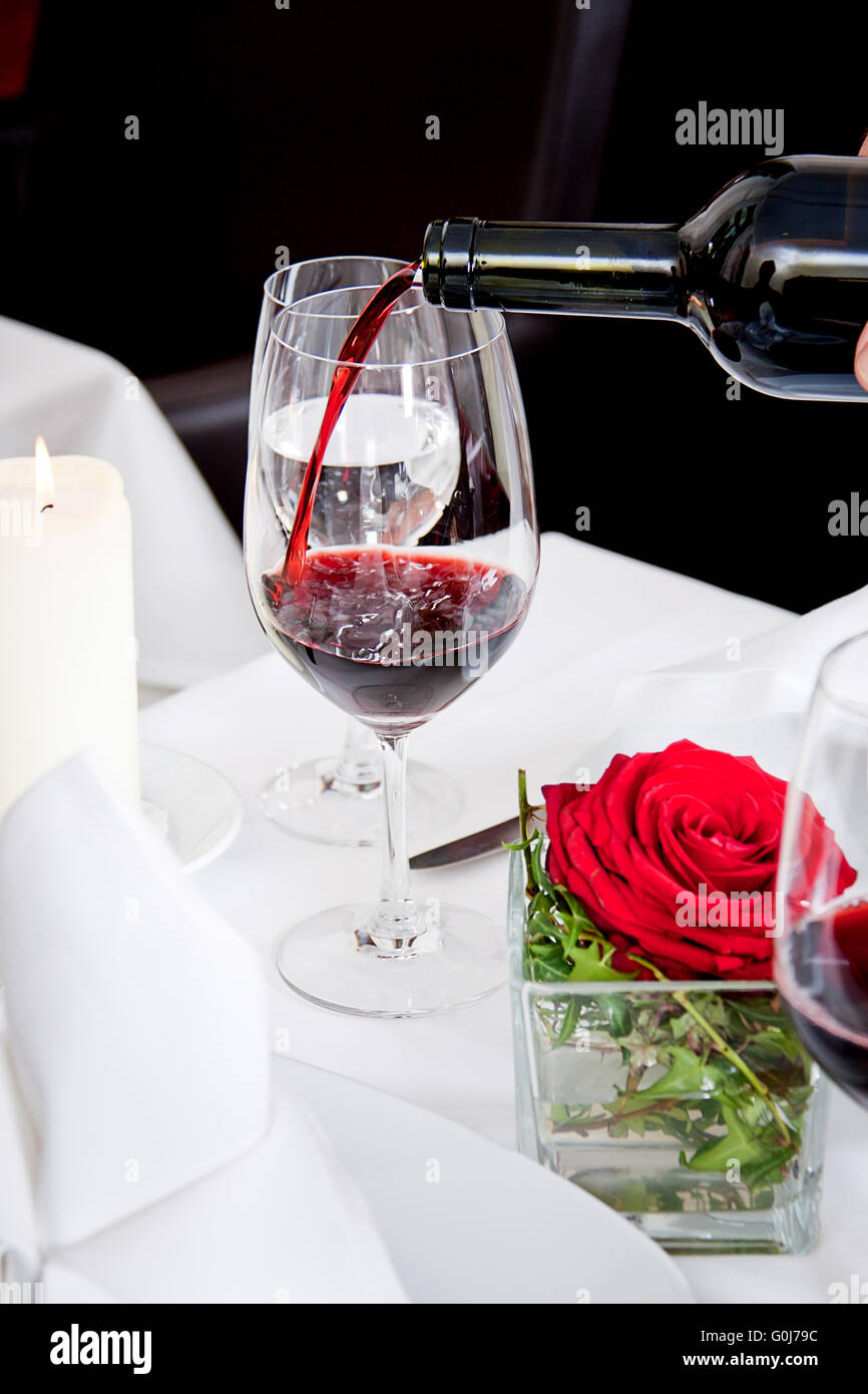 couple drinking red wine in restaurant Stock Photo - Alamy