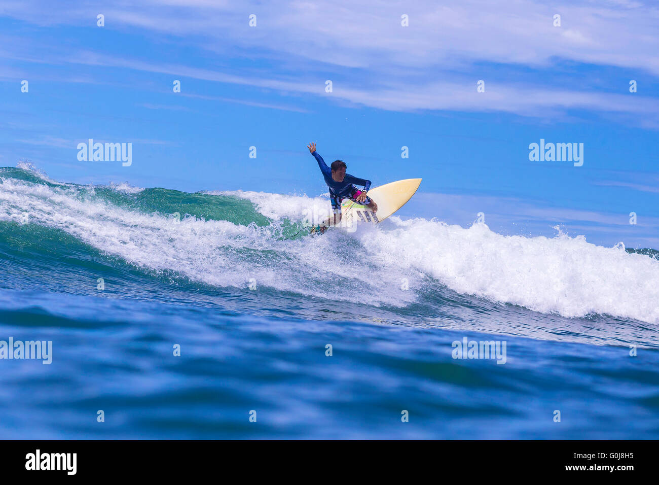 Surfer on Amazing Blue Wave, Bali island Stock Photo - Alamy