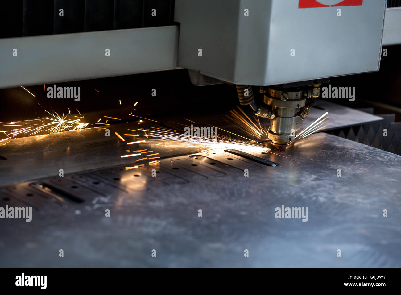 Modern automated machine laser cutting metal sheet Stock Photo - Alamy