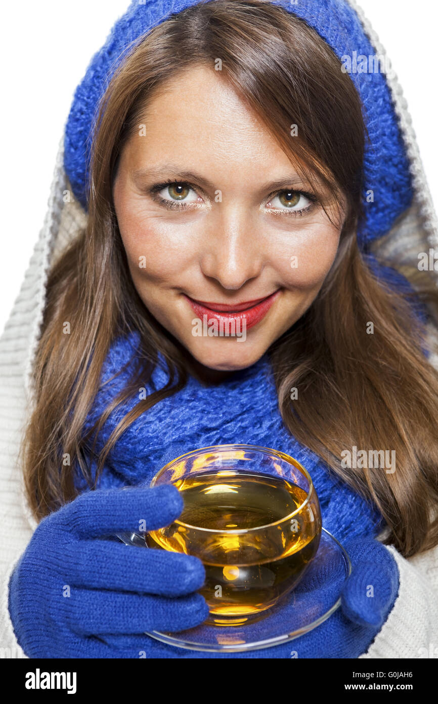 Fashionable young woman sipping hot tea Stock Photo - Alamy