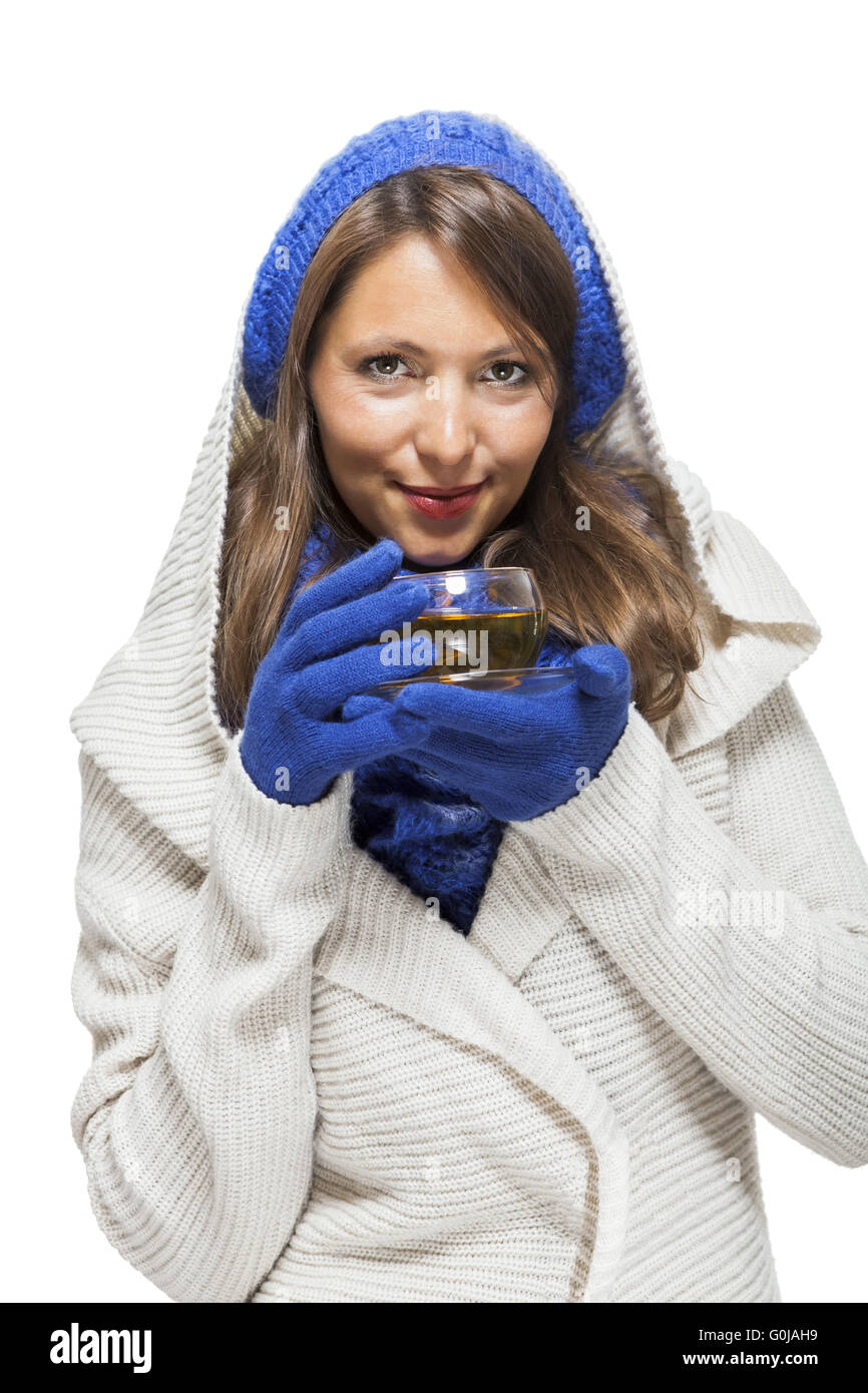 Fashionable young woman sipping hot tea Stock Photo - Alamy