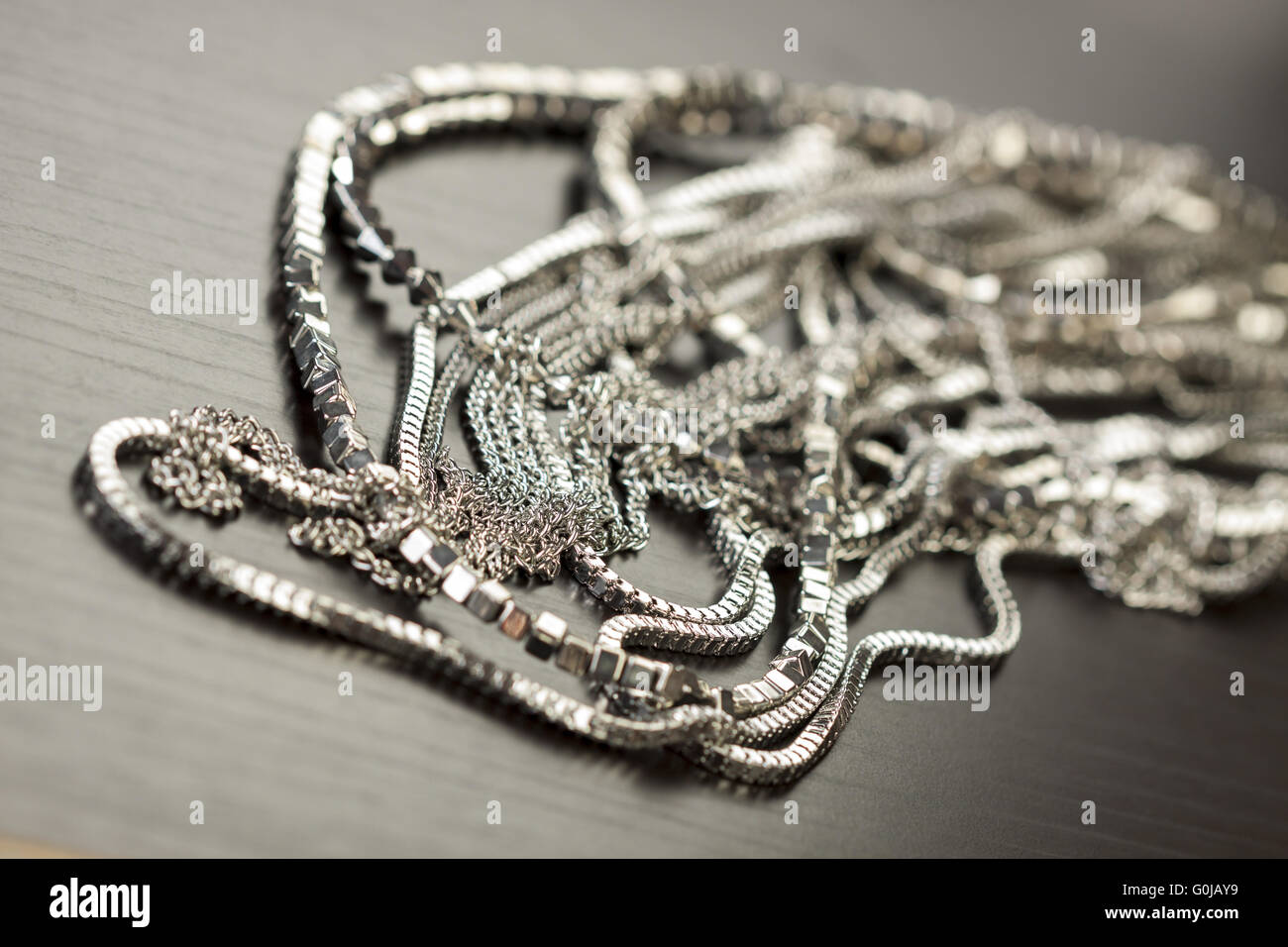 Pile of assorted silver chains Stock Photo - Alamy